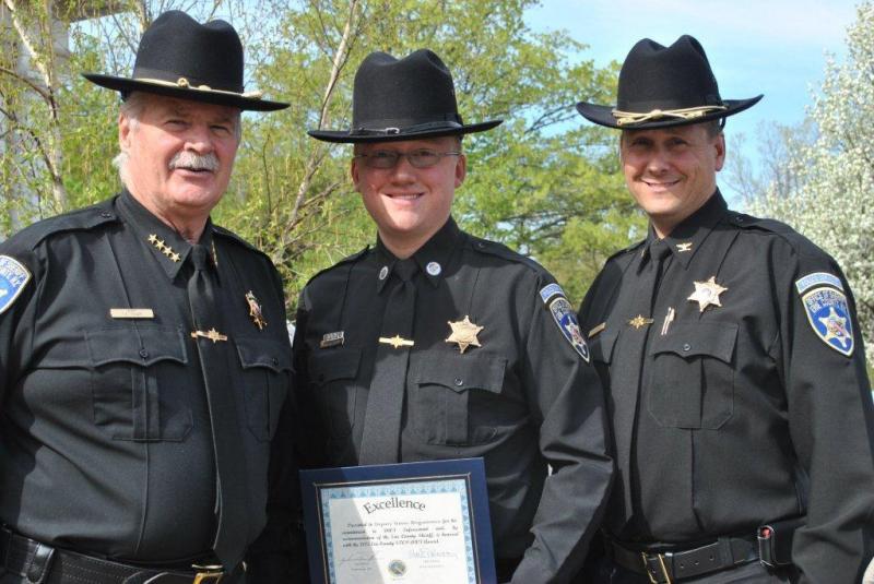 Sheriff Tim Howard and Chief Scott Joslyn congratulate Deputy for being ...