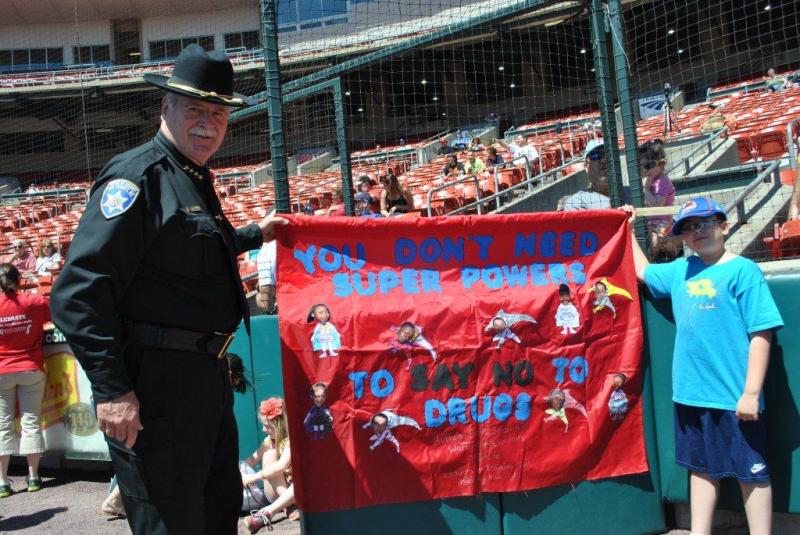 Sheriff Tim Howard takes part in the annual Red Ribbon Bisons pre-game ...